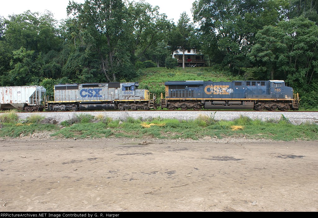 Broadside of CSXT units 785 (tagged) and 8404 (shabby) WB on Q69912 from the drained James River ...